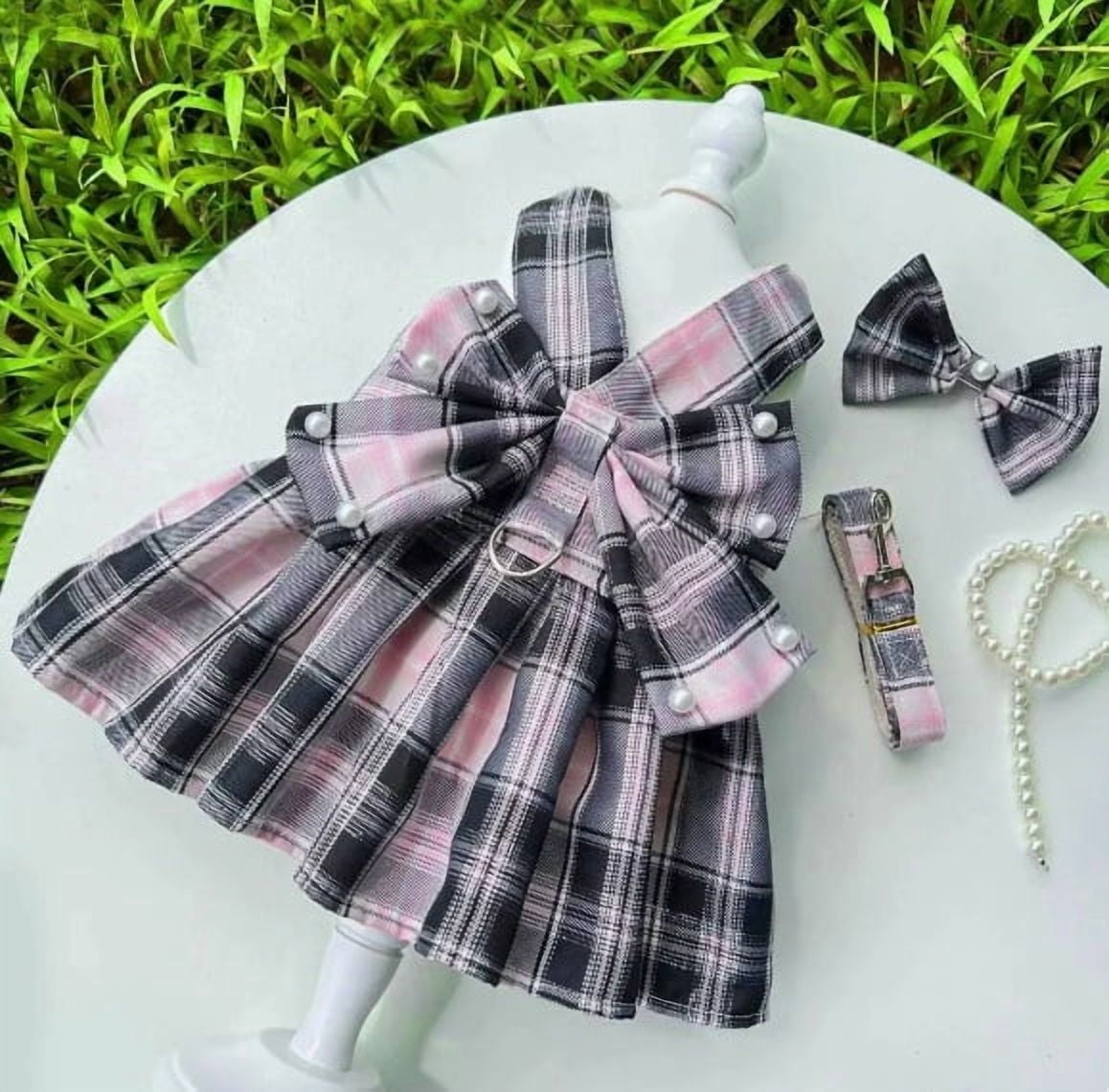 2 sets of black and pink plaid skirts, harnesses, leashes, vests and ...