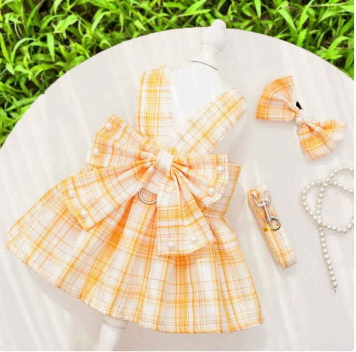 2 sets of bright yellow plaid skirts, harnesses, leashes, vests and ...