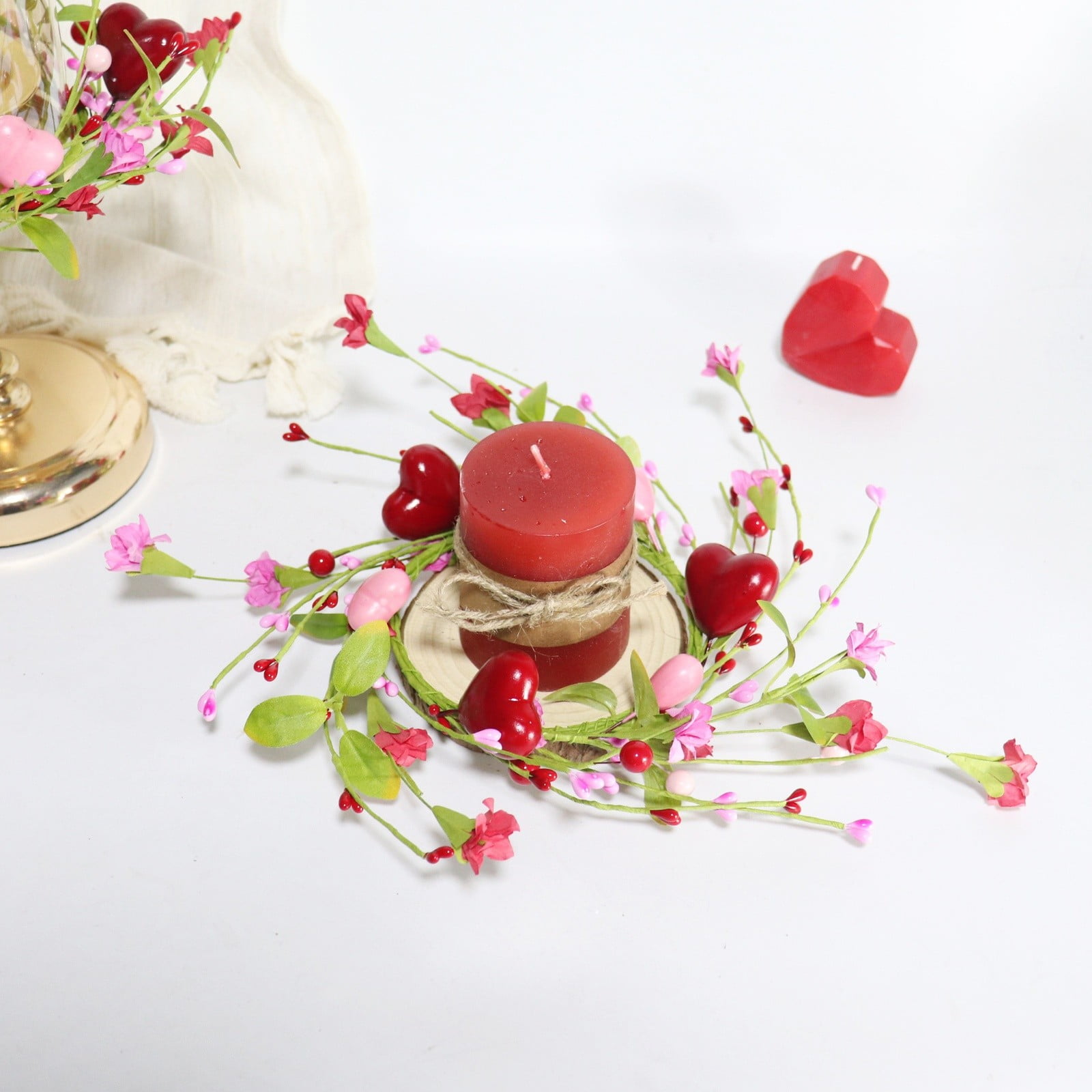 A Candle Ring with Red Flowers and Berries Symbolizing Love for ...