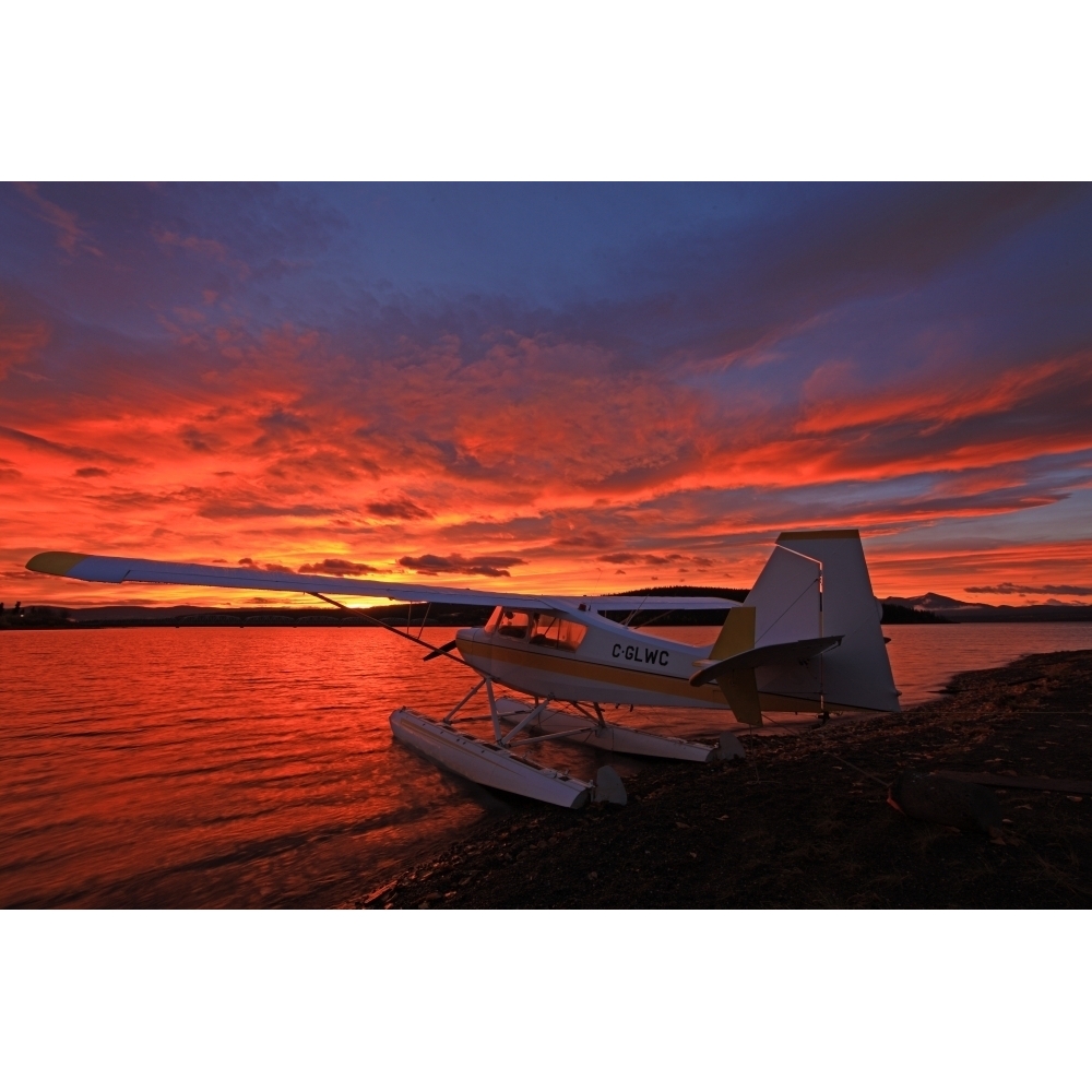 A Float Plane Facing The Sunrise Over Teslin Lake Yukon Poster Print ...