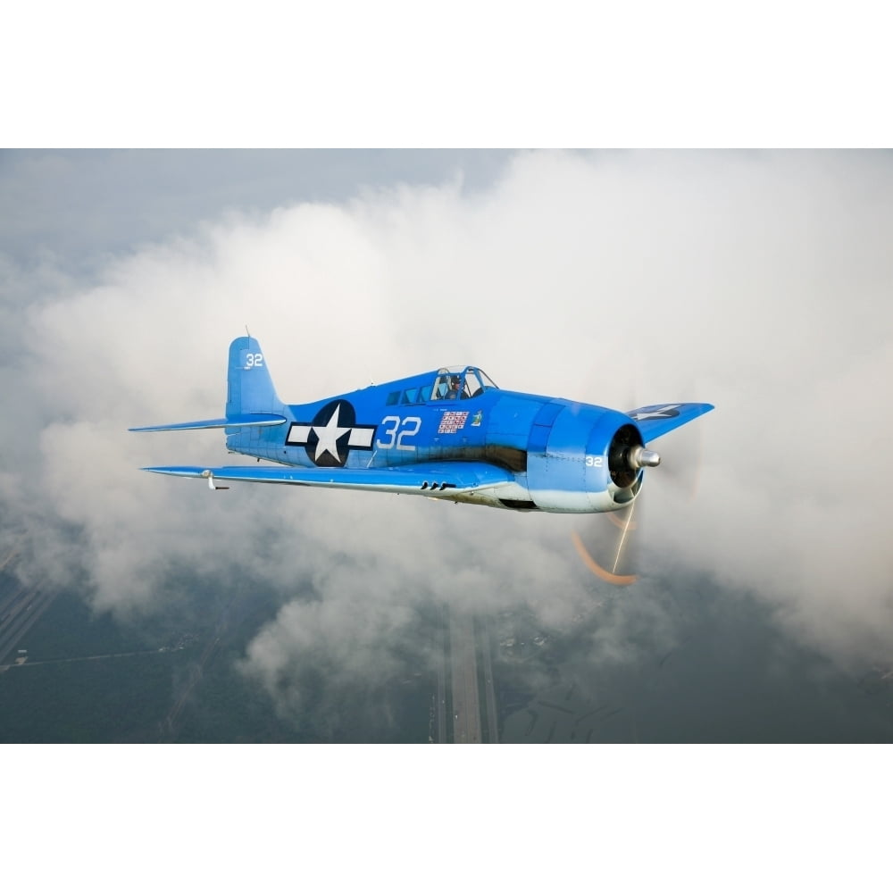 A Grumman F6F Hellcat fighter plane in flight over Chino, California ...