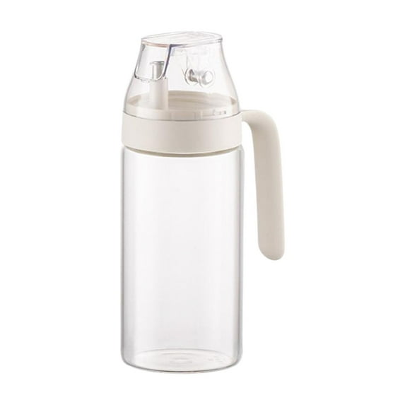 A Transparent Glass Oil Dispenser Bottle With Automatic Lid Leak Proof ...