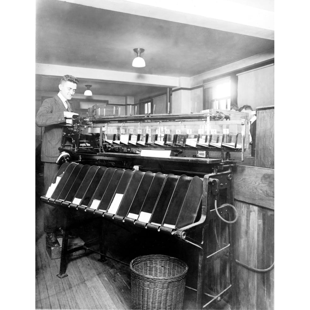 A Us Census Worker Oversees The Automatic Card Sorting Machine Used For ...