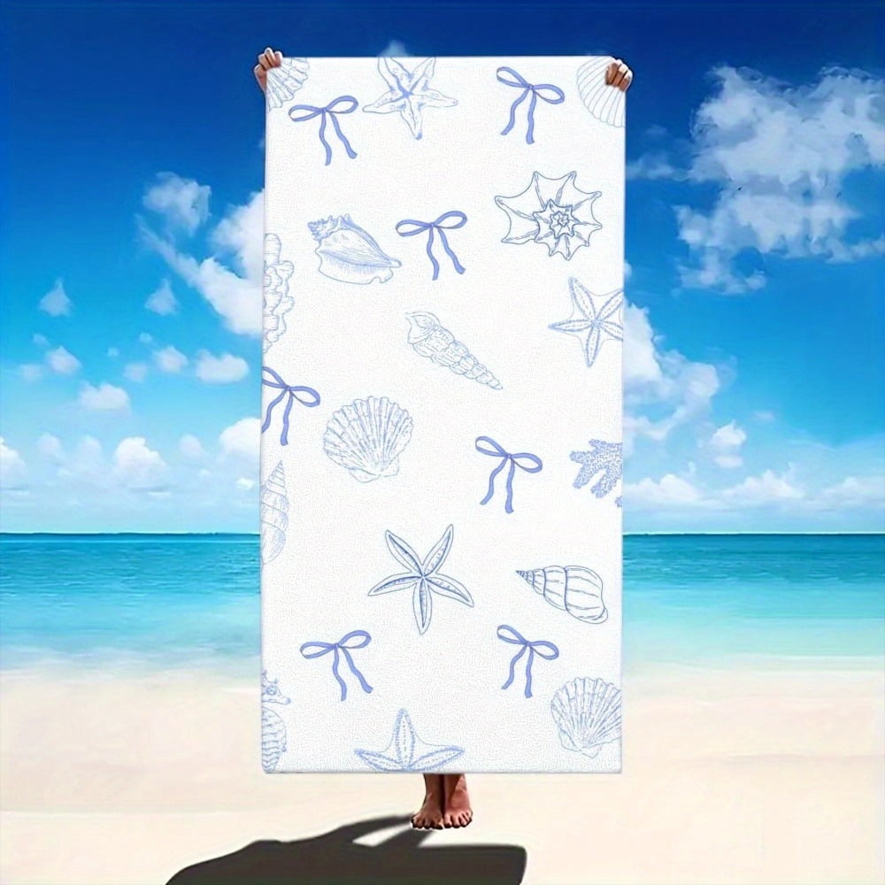 A beach towel decorated with shells, starfish and bows - ideal for ...