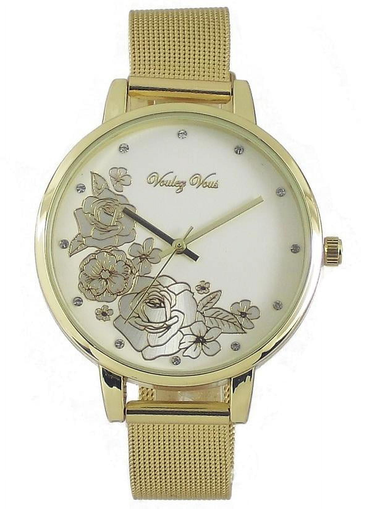 A beautiful white flower dial watch with twelve crystals paired with a ...