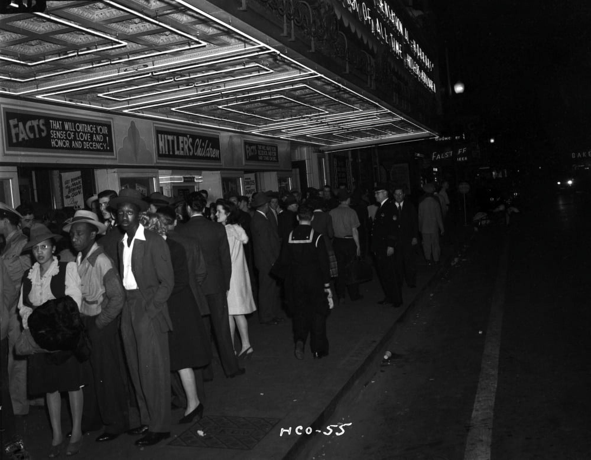A crowd waiting outside of a movie theatre Photo Print (24 x 30 ...