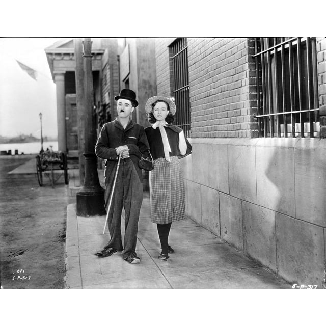 A film still of Charlie Chaplin walking with a co star Photo Print (8 x ...