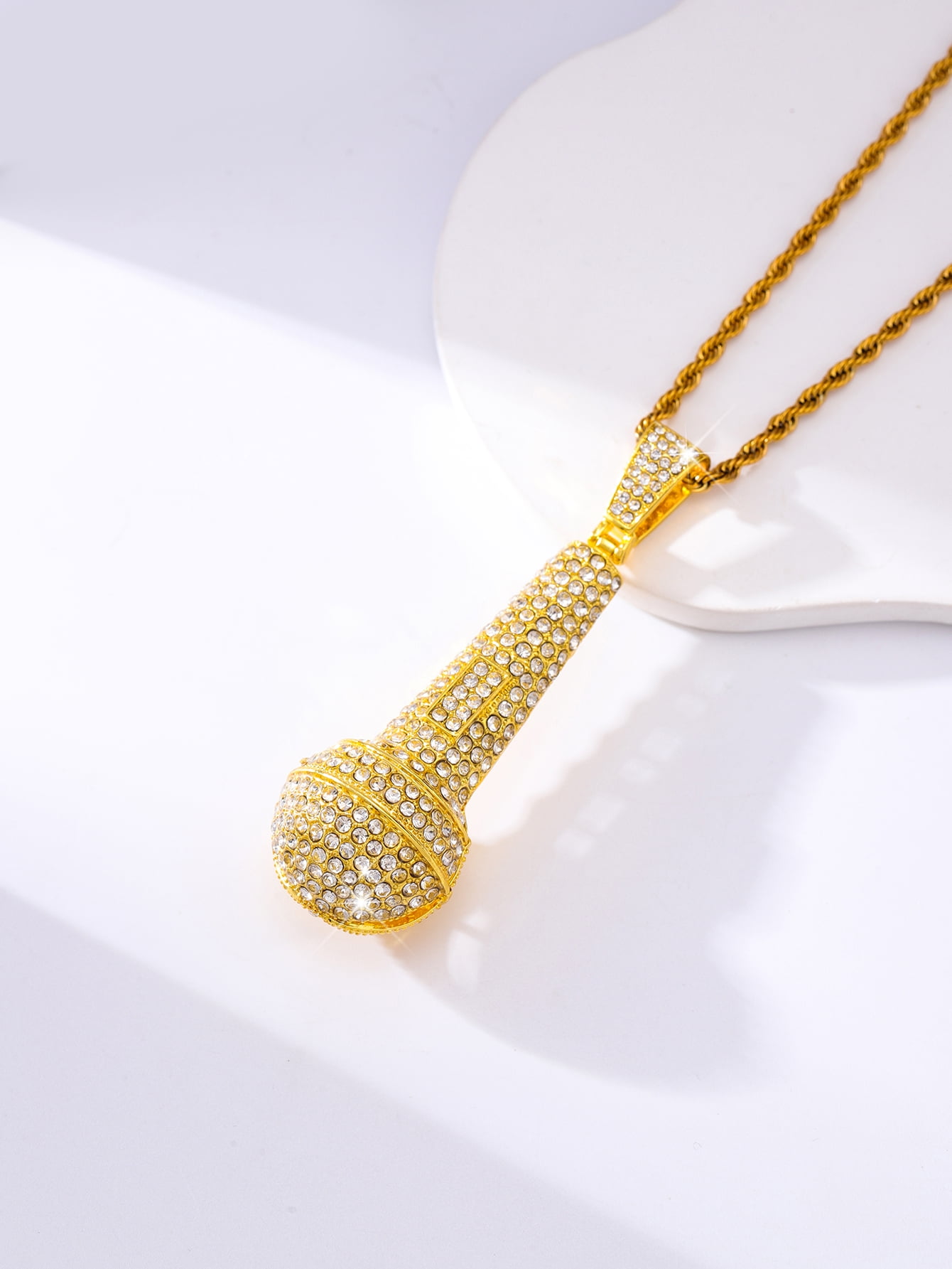 A gold microphone pendant necklace, a 2025 fashion style, is suitable ...