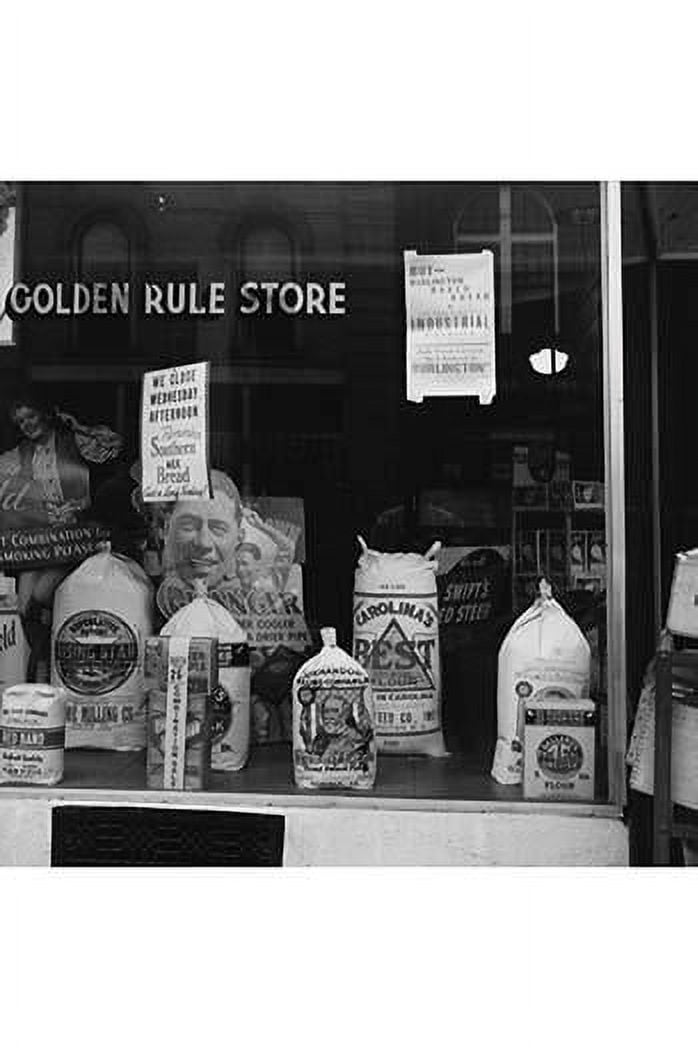 A grocery window; sacks of flour in the window of the Golden Rule Store ...