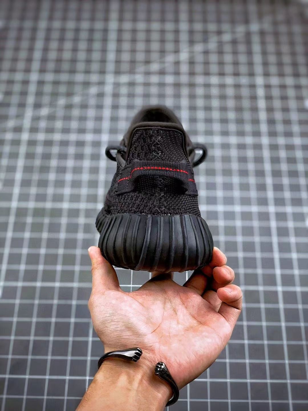 A pair of men's and women's identical sports running shoes made of mesh ...