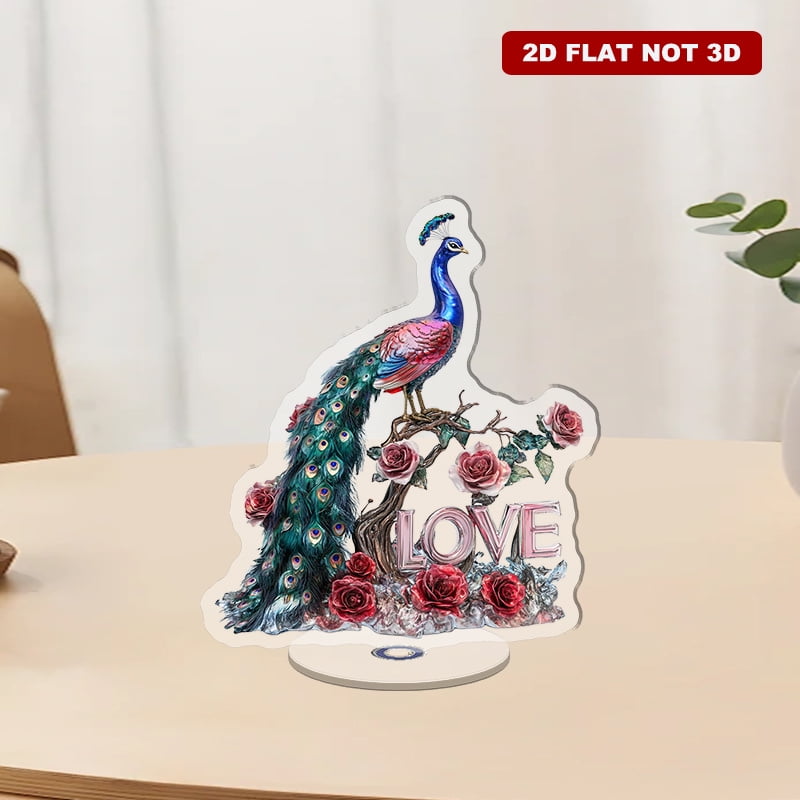 A rotating acrylic centerpiece featuring a beautiful peacock on a tree ...