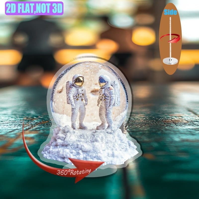 A rotating acrylic display featuring astronauts on the moon in a pastel ...