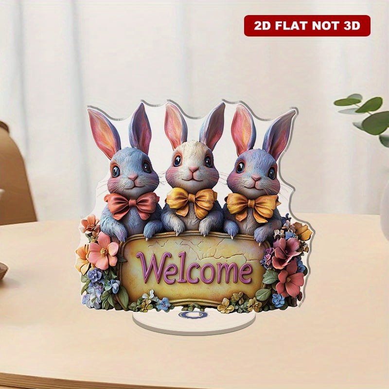 A rotating acrylic display featuring three cute rabbits on a colorful ...