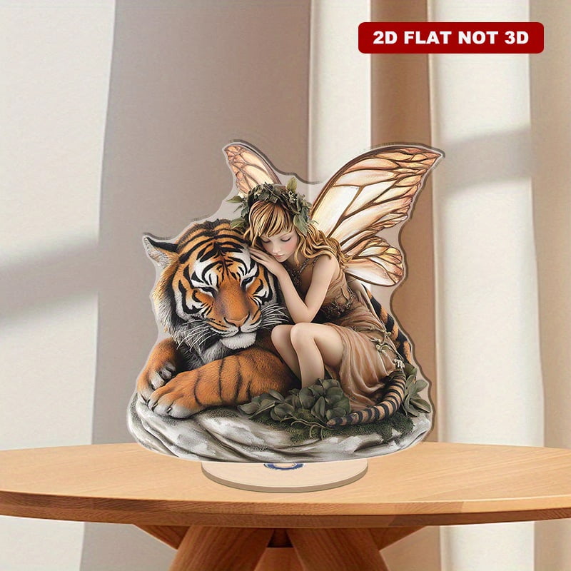A rotating acrylic ornament showcasing a fairy with transparent wings and a tiger, highlighting ...