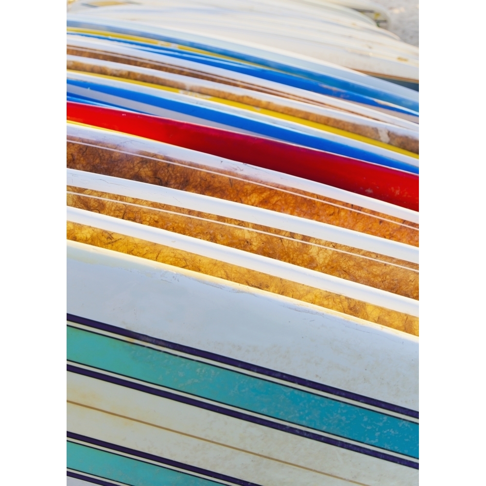 A stack of colourful longboard surfboards placed on the beach,; Waikiki ...