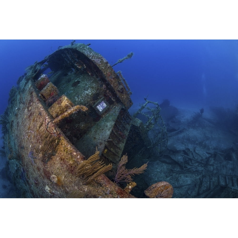 A sunken ship lays on its side near Grand Bahama Island Bahamas Poster ...
