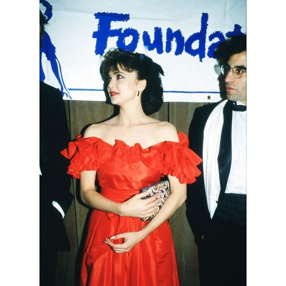 Actress Emma Samms looking to the side wearing a red dress at Starlight ...