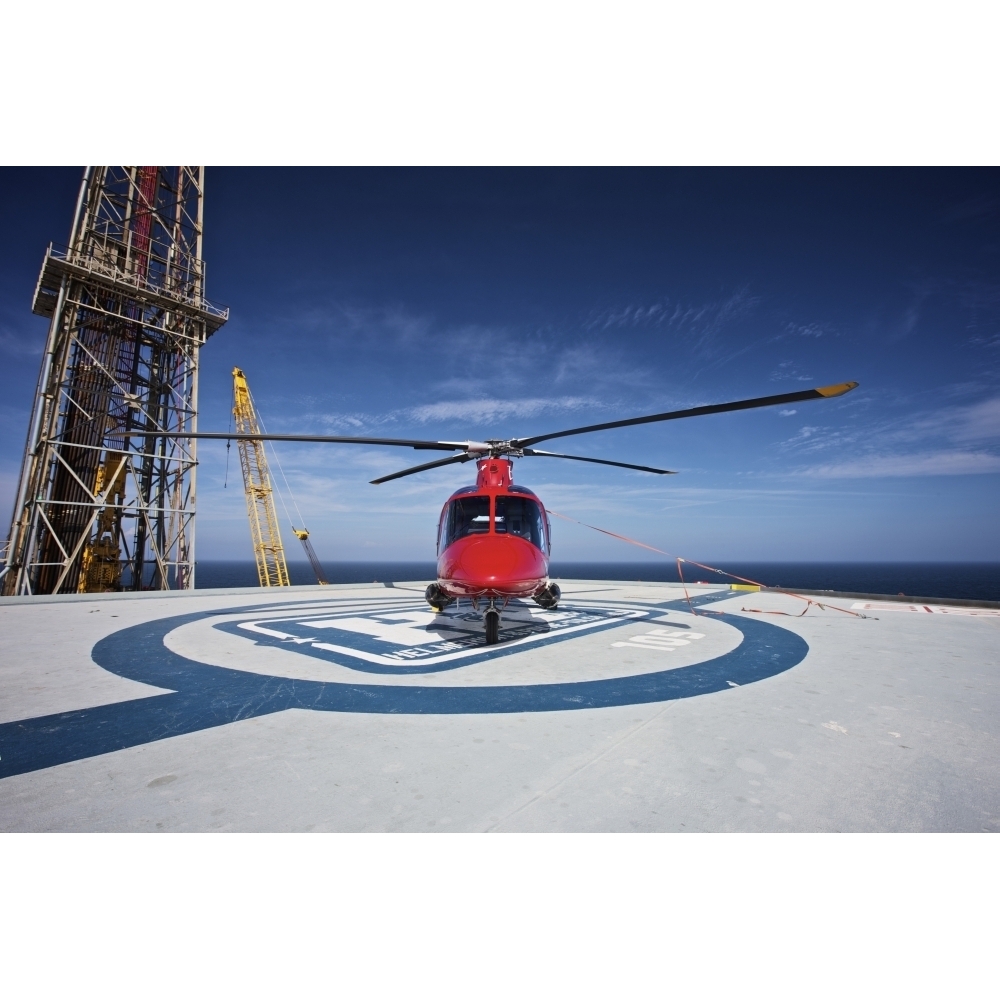 AgustaWestland AW109E utility helicopter on the helipad of an oil rig ...