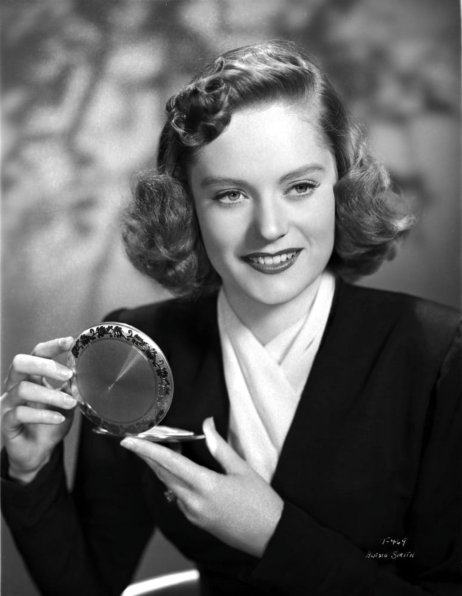 Alexis Smith smiling while Holding a Make up Kit Photo Print (24 x 30 ...