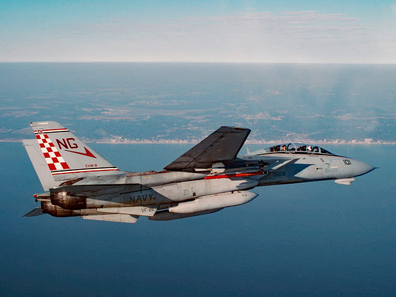 An F-14A Tomcat cruises near Virginia Beach during a morning training ...