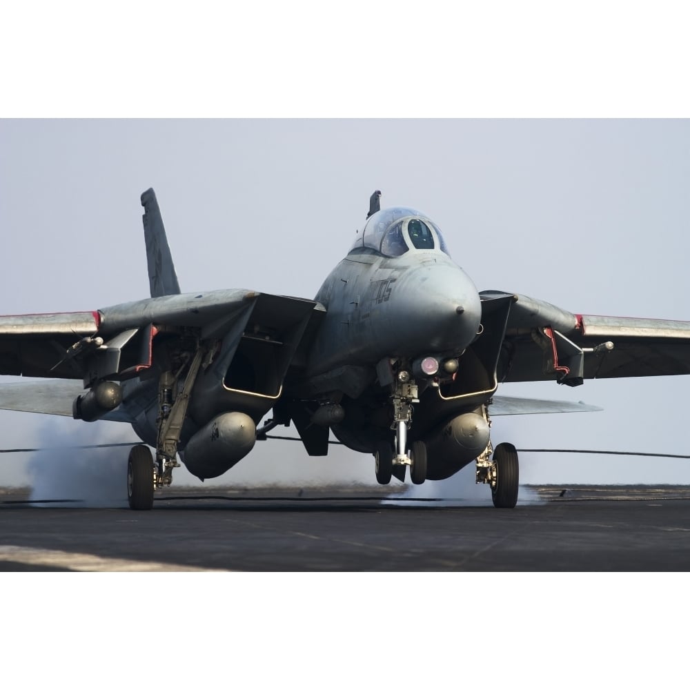 An F-14D Tomcat makes an arrested landing on the flight deck of USS ...