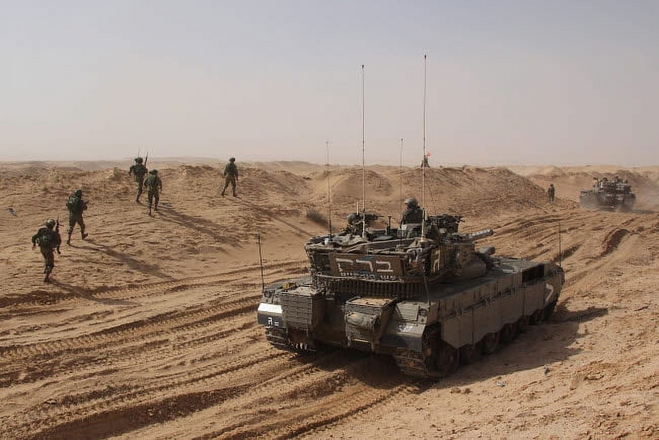 An Israel Defense Force Merkava Mark II battle tank with infantry ...