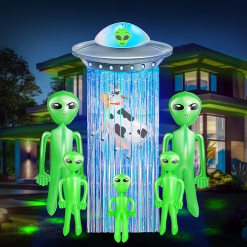 An alien-themed party decoration set including tinsel foil door ...