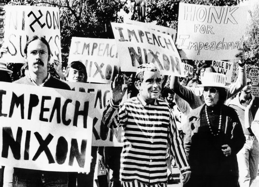 Anti-Nixon Demonstrators At The White House. One Demonstrator Wears A ...