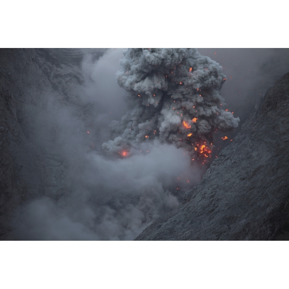 Ash cloud rising during strombolian eruption of Batu Taru volcano ...