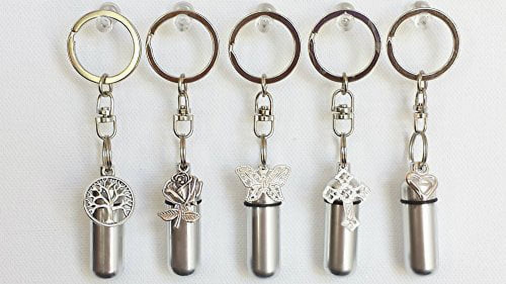 Assortment of FIVE LASER ENGRAVED CREMATION URNS on Stainless Steel ...