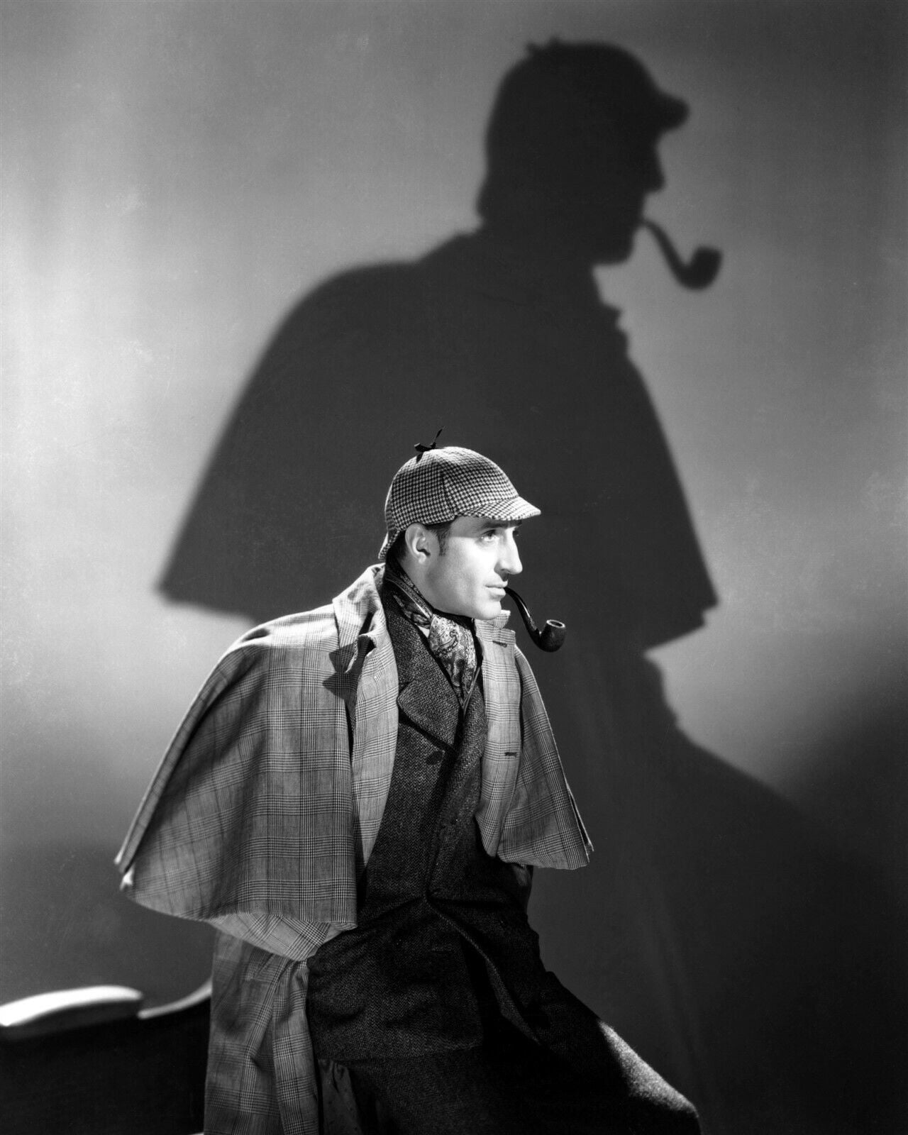 Basil Rathbone as Sherlock Holmes with shadow on wall behind him 24x30 ...