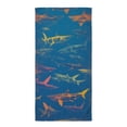 Beach towels with sharks A large group of sharks swimming in the ocean ...