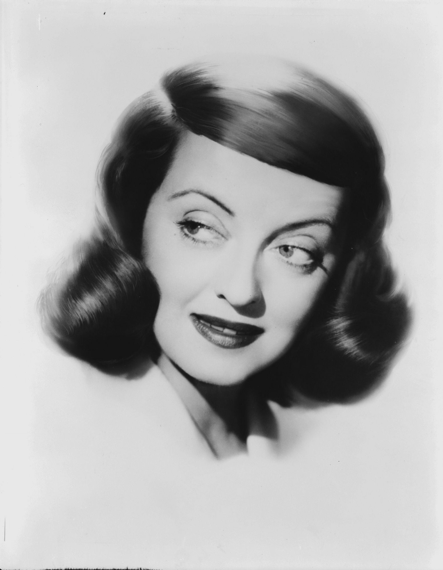 Bette Davis Close Up Portrait with Curled Hair Looking at the Left in ...