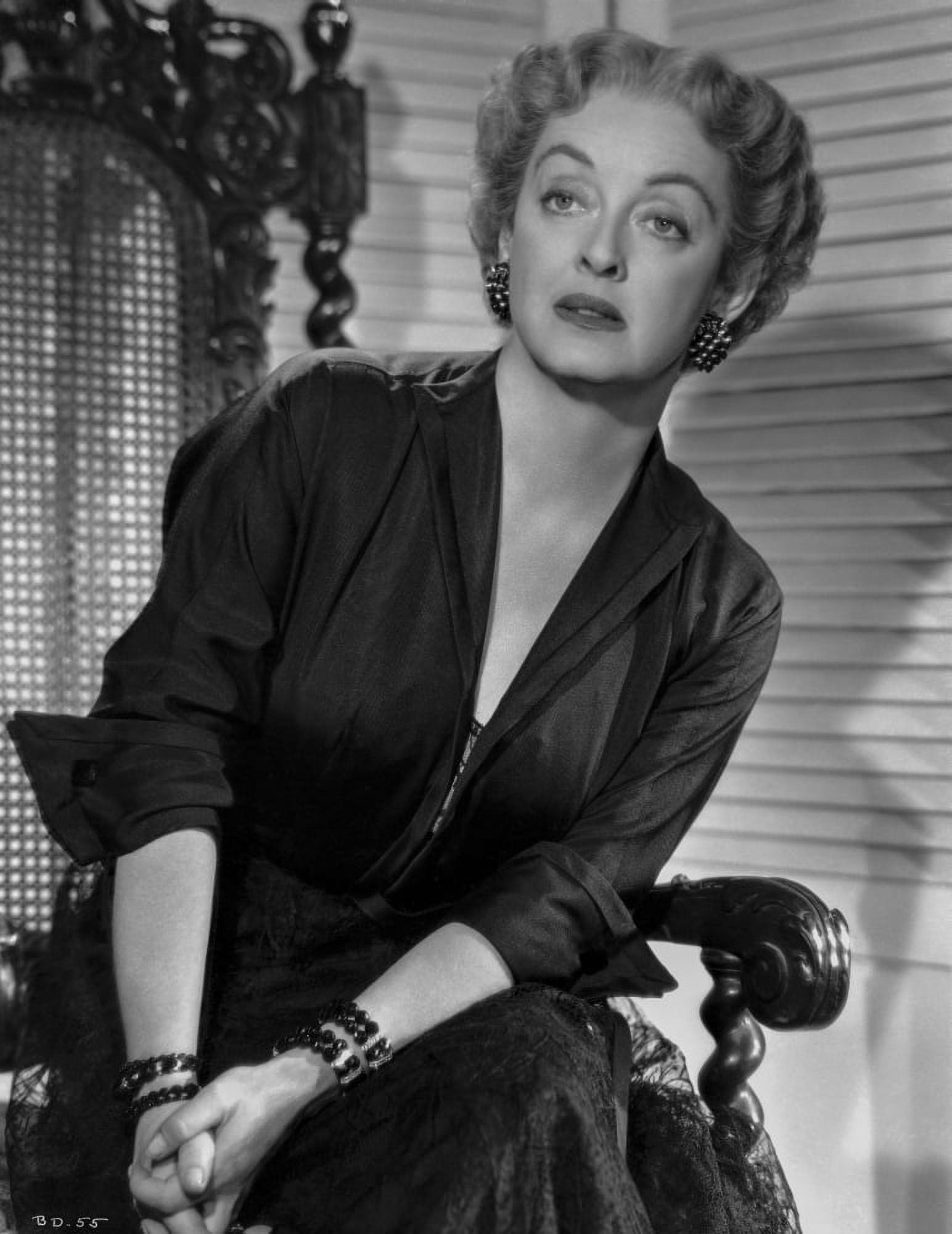Bette Davis Seated on Chair with Hands Together in Black V-Neck Folded ...
