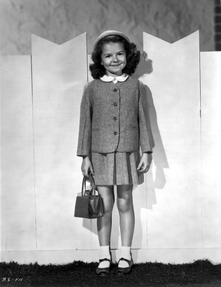 Beverly Simmons standing in School Uniform with Bag in Gray scale Photo ...