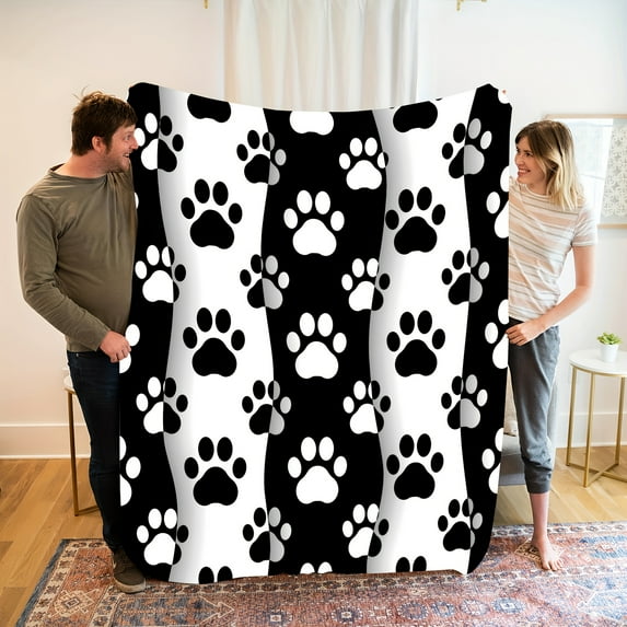A Black And White Paw Print Flannel Blanket Featuring a Classic Pet Paw ...