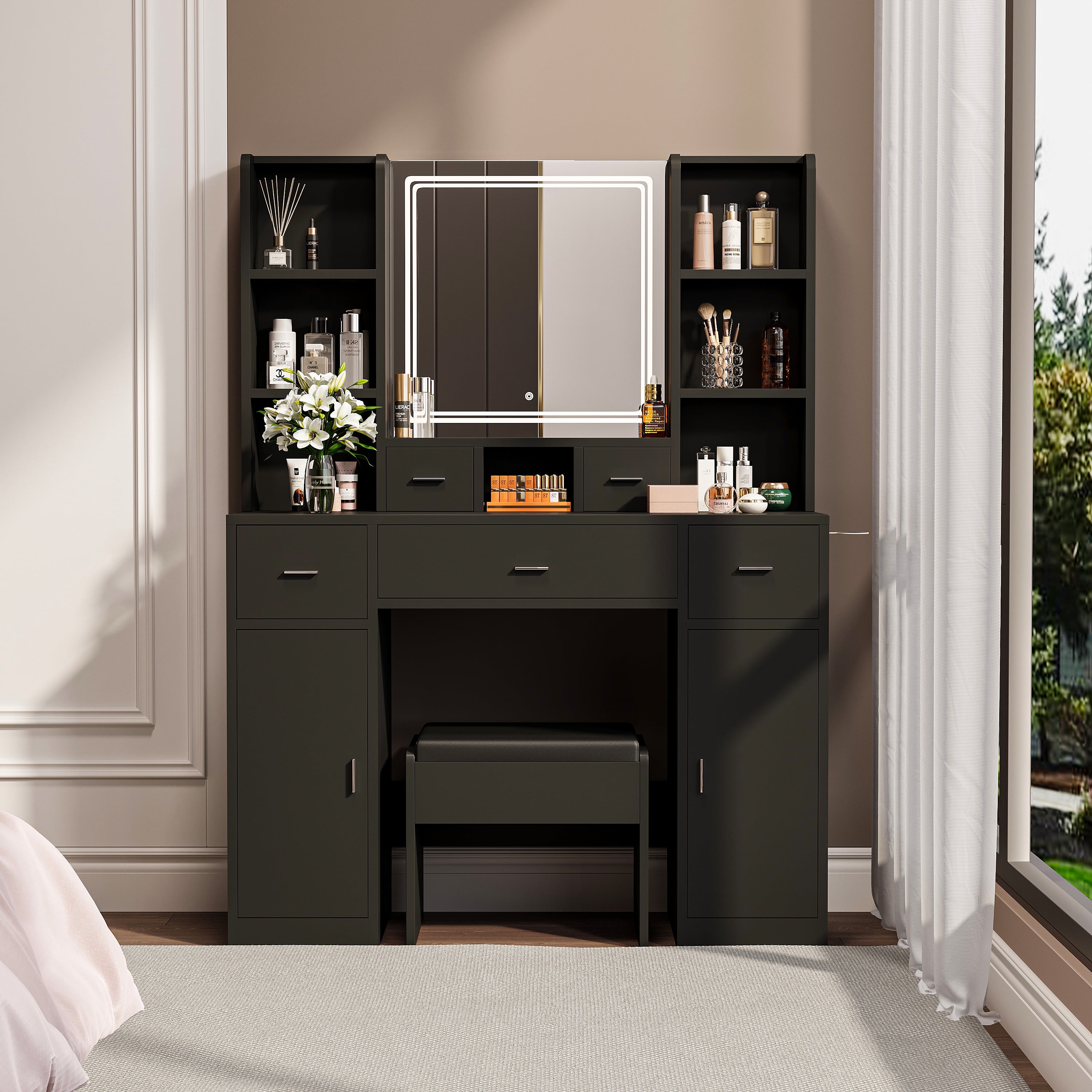 The Black dressing table with LED mirror is equipped with a hair dryer ...