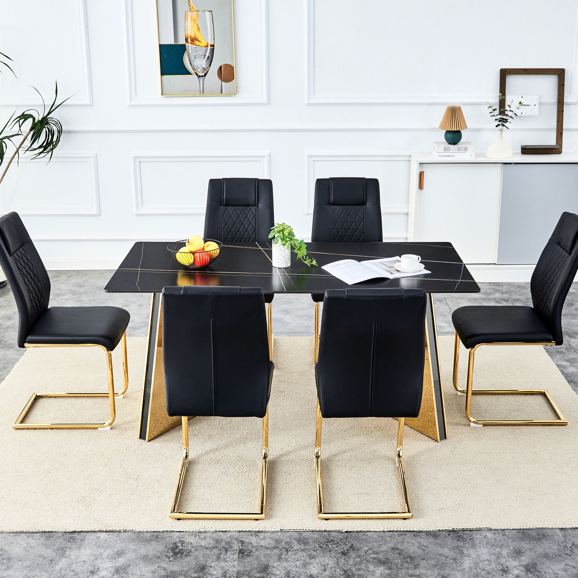 Black sintered stone table with golden stainless steel legs paired with ...
