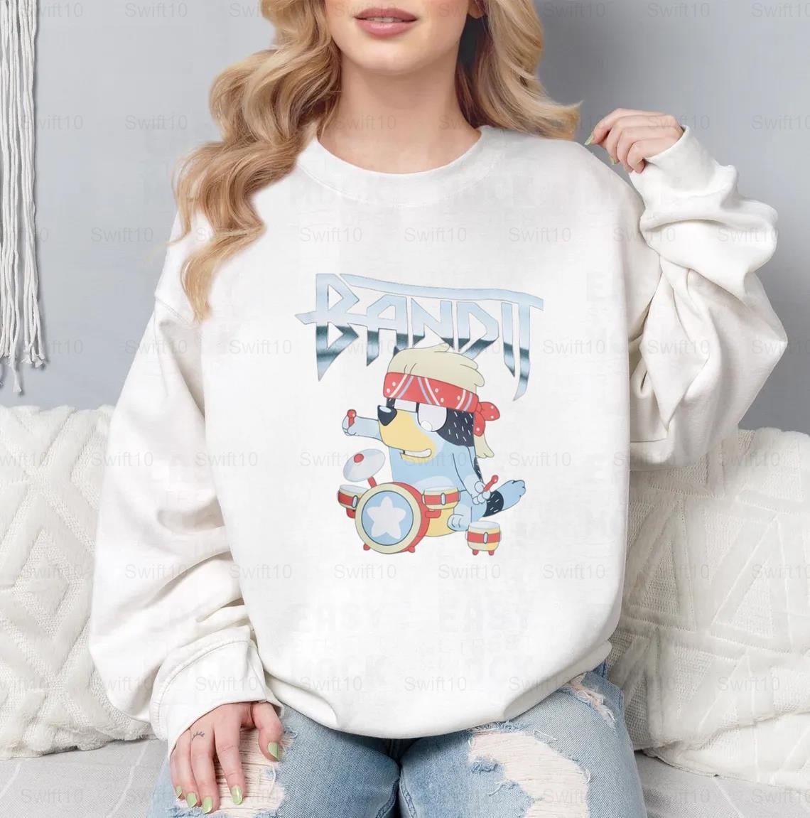 Bluey Bandit Playing Drums in Varsity Cartoon T-shirt, Sweatshirt ...