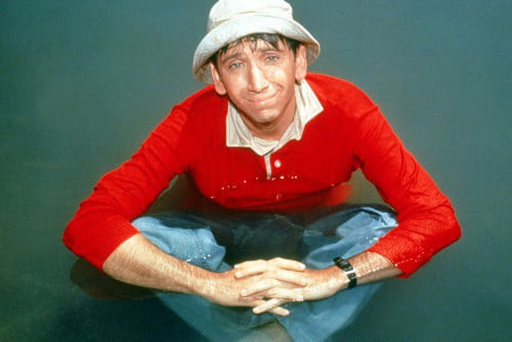 Bob Denver in Gilligan's Island smiling pose looking up seated in water ...