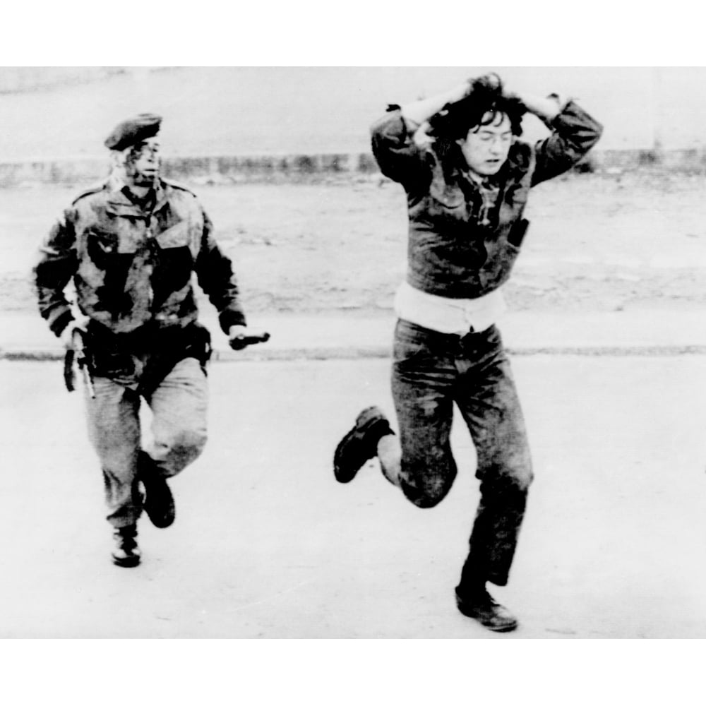 British Soldier Chasing A Demonstrator During A Riot In Londonderry ...