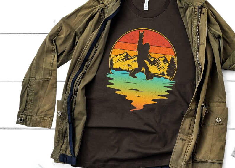 Brown Retro Bigfoot Rock Hand Sunset Mountain Graphic Comfort Colors T ...