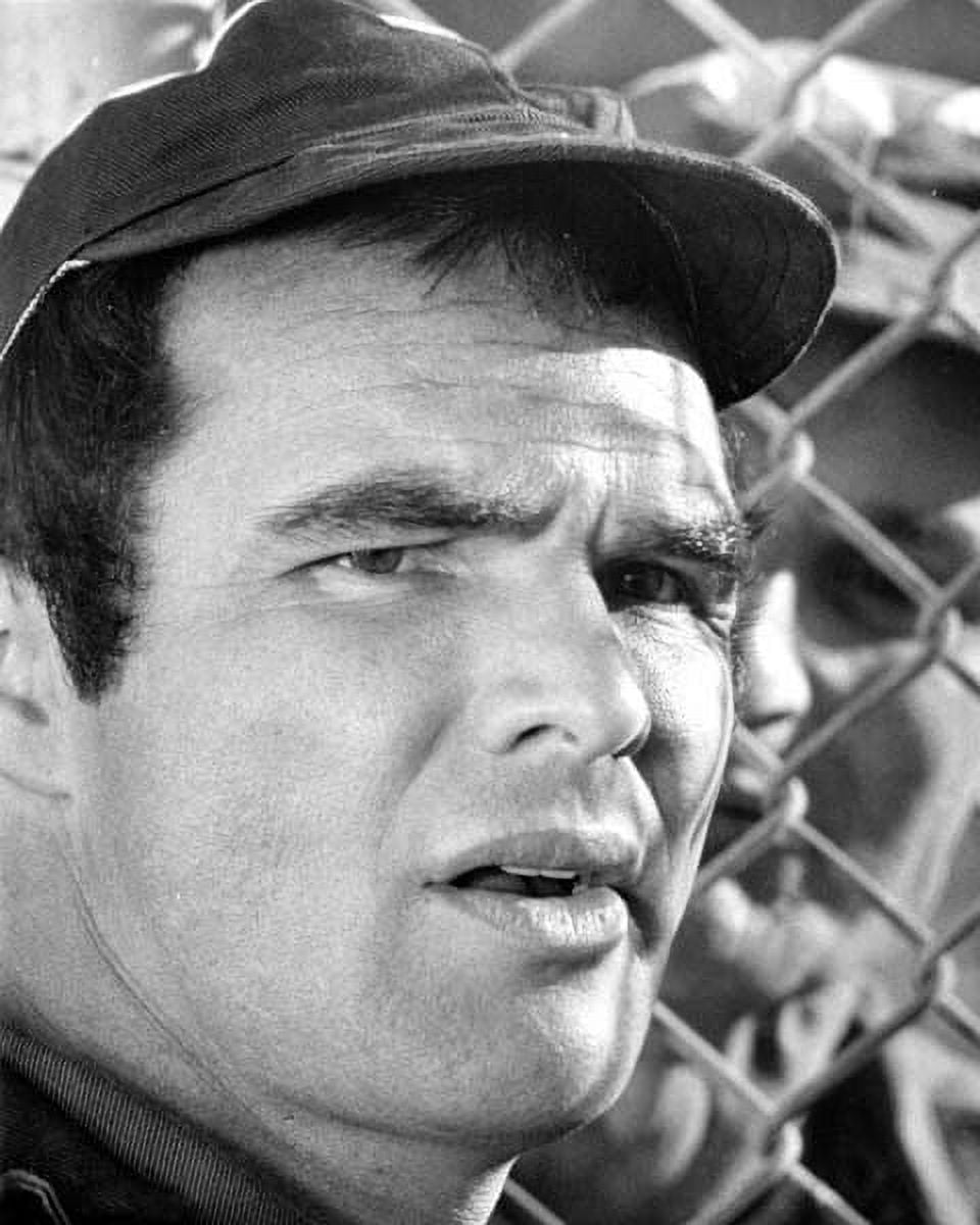 Burt Reynolds in baseball cap by fence 1974 The Longest Yard 24x30 inch ...