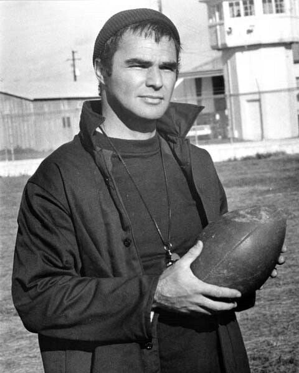 Burt Reynolds in black beanie hat holding football The Longest Yard ...
