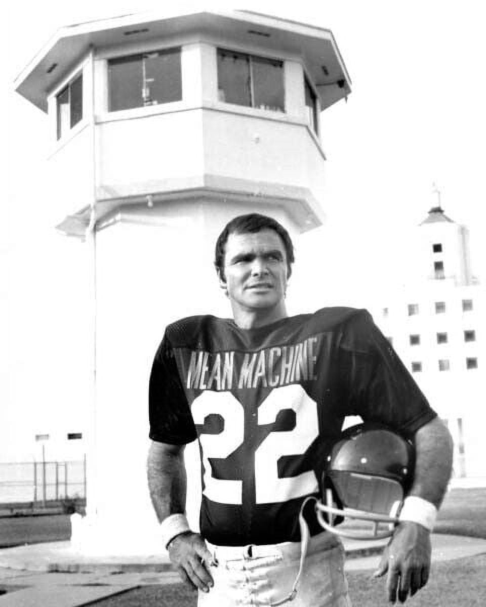 Burt Reynolds in football jersey holds helmet 1974 The Longest Yard ...