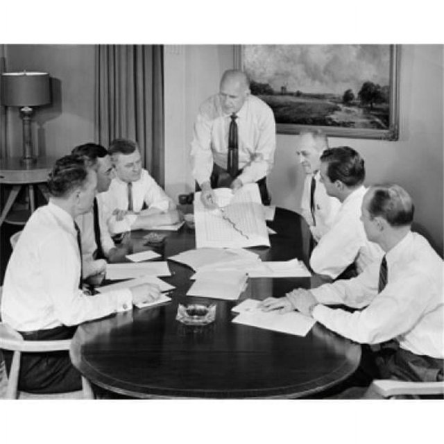 Business Executives Discussing Chart in Conference Room Poster Print ...
