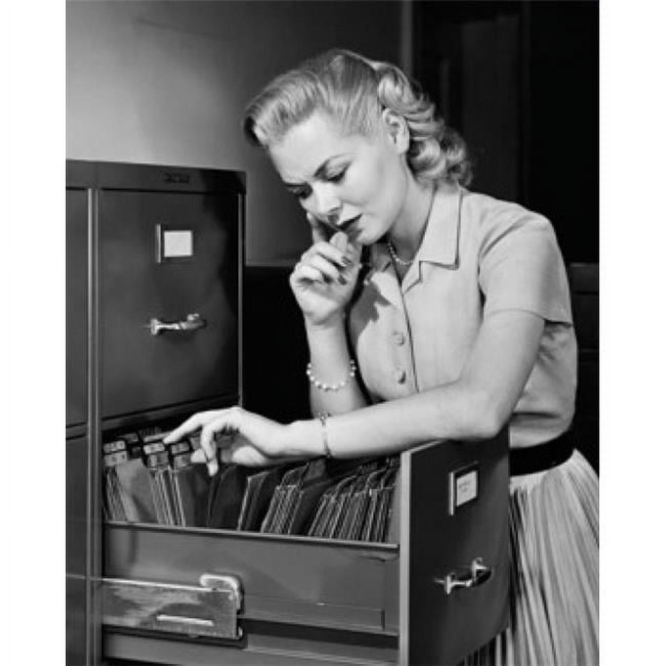 Businesswoman Searching for Files in a Filing Cabinet Poster Print - 18 ...