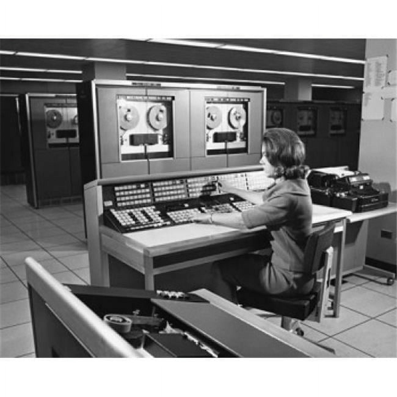 Businesswoman Working on a Mainframe Computer in an Office Poster Print ...