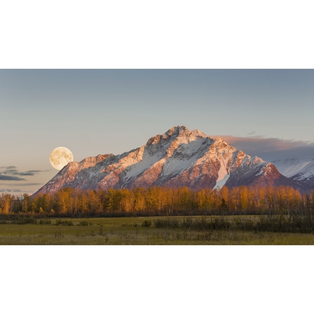 COMPOSITE Scenic sunset view of Pioneer Peak with the full moon rising ...