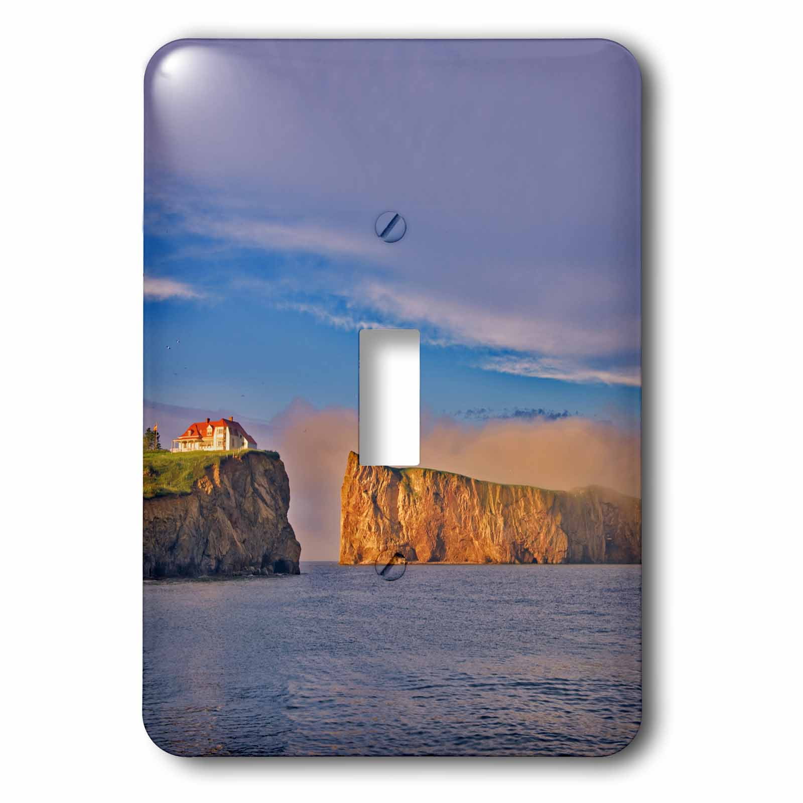 Canada, Quebec, Perce. House on cliff and Perce Rock, Atlantic Ocean ...
